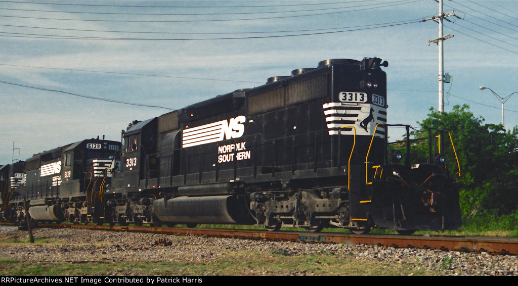 NS 3313 SD40-2 leading NS 6139 X-NW SD40-2 and NS 4131 X-SOU GP38AC a TOFC-COFC train south ...